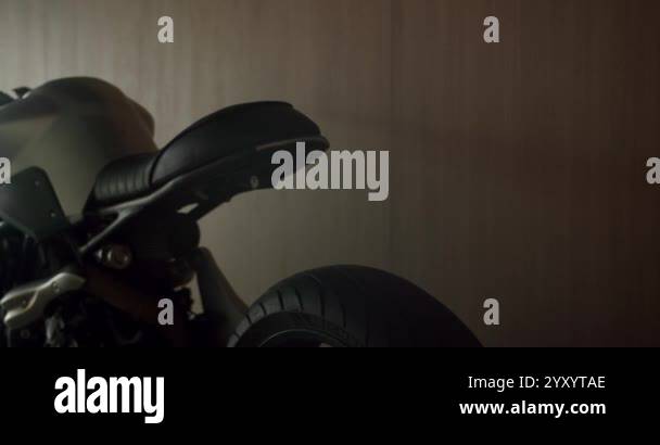 Minimalist wooden wall with concrete floor. Sports motorcycle inside ...