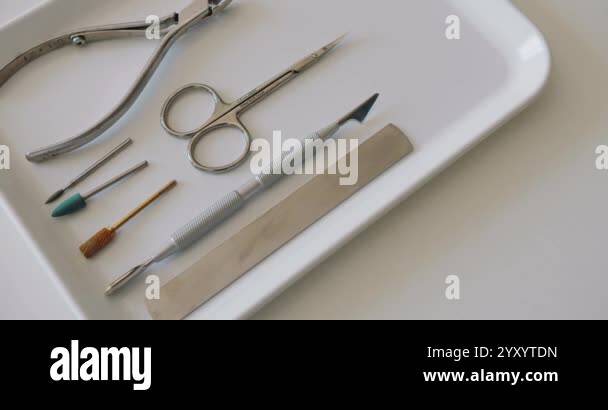 Sterile professional manicure tools on tray prepared for nail care ...