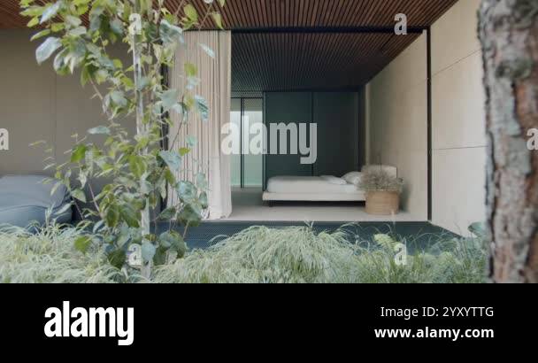 This image showcases a modern bedroom with sleek design and natural touches. The space blends ...