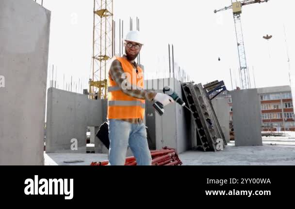 Funny construction worker dancing. Positive dance of builders in helmet ...