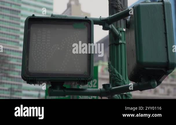A vibrant red hand symbol serves as a clear indication for pedestrians ...