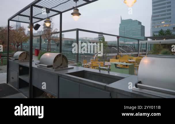 An elegant outdoor kitchen that showcases modern urban design and ...