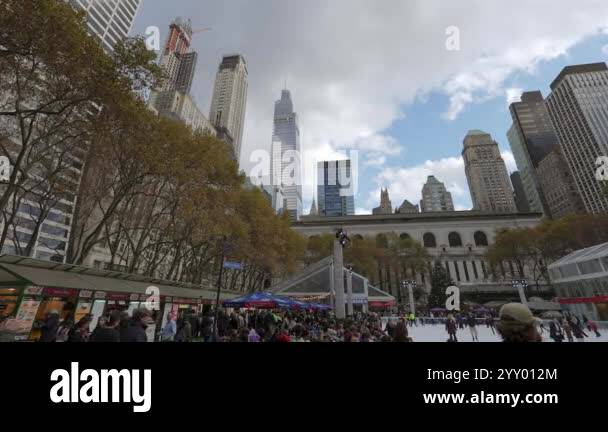 NEW YORK, USA - NOVEMBER 30, 2024: A lively ice skating rink at Bryant ...