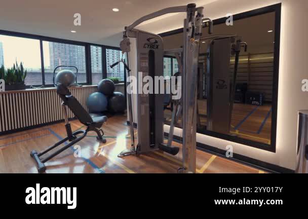 JERSEY CITY, USA - DECEMBER 2, 2024: The stylish gym interior features ...