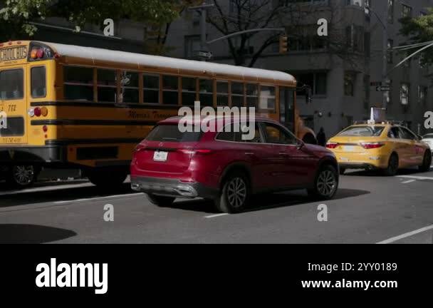 A vibrant city scene showcases a bright yellow taxi positioned next to ...