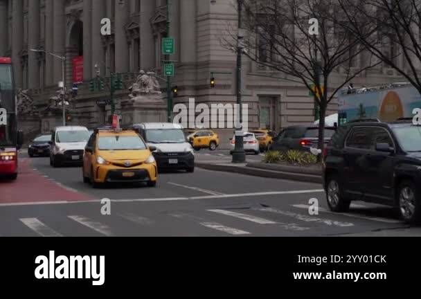 NEW YORK, USA - FEBRUARY 23, 2024: A bustling city street teeming with ...