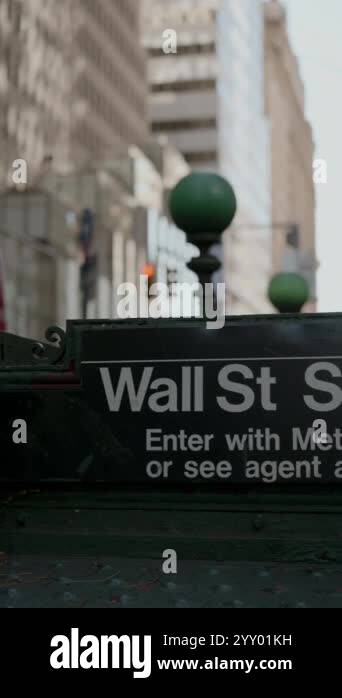 Heres a detailed view of the entrance to the Wall Street subway station ...