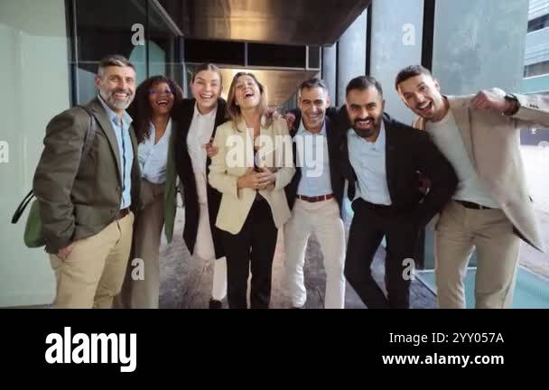 Diverse group of smiling business professionals standing together in ...