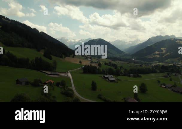 Picturesque Swiss valley of Saanen on a sunny day, green alpine valley ...