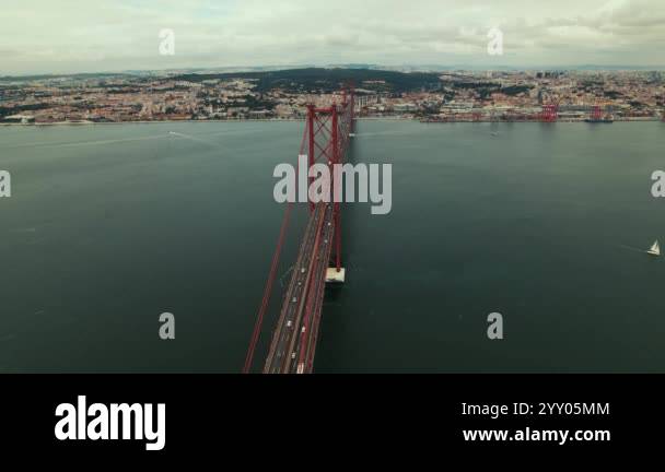 Aerial view suspension bridge over Tagus river in Lisbon. Drone flying ...