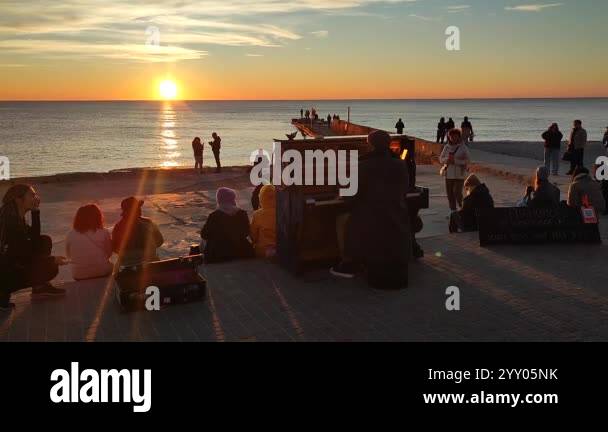 Odessa, Ukraine, November 2, 2024: Pianist playing piano on seashore ...