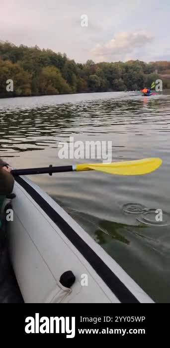 Person woman sitting in inflatable boat kayak gray color with yellow ...