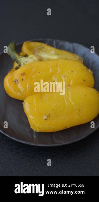 Yellow sweet pepper cut in half and grilled with salt, spices and herbs ...