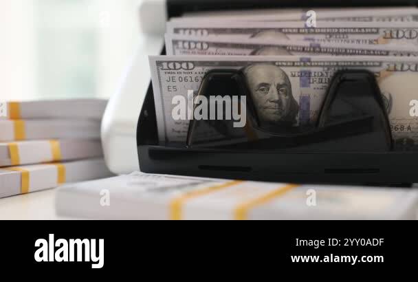 Contemporary money counting machine counts dollar bills. Currency ...