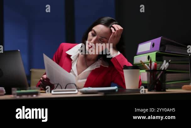 Exhausted woman manager falls asleep paper working in night office ...
