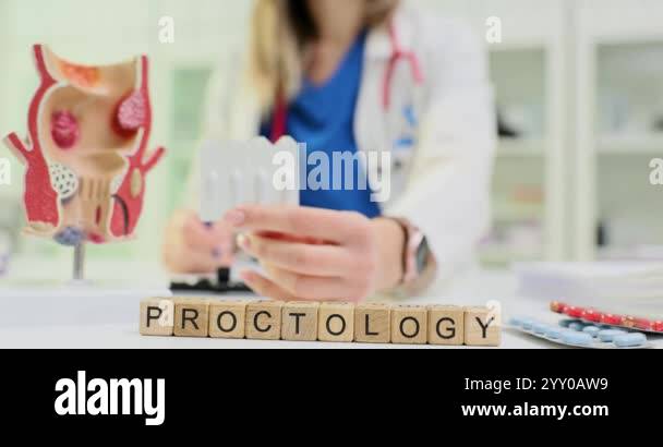 A healthcare professional is carefully examining a detailed proctology ...