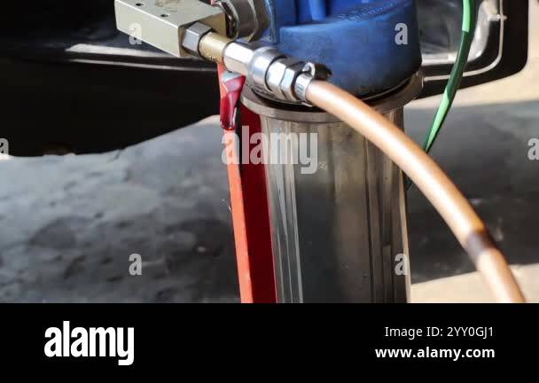 Replacing engine oil on a motorcycle with an oil suction machine Stock ...