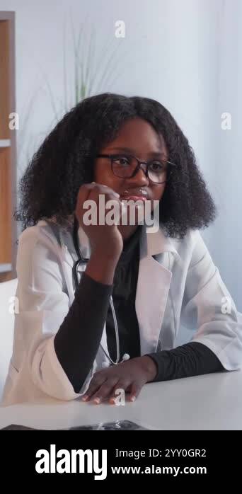 Vertical video. Medical frustration. Doctor burnout. Unhappy woman ...