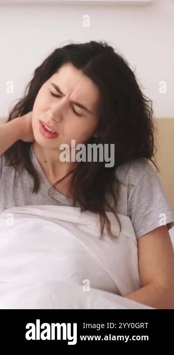 Vertical video. Neck pain. Uncomfortable bed. Posture problems ...