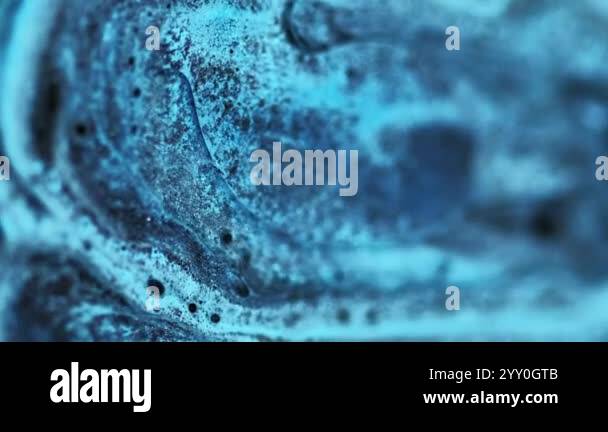 Ink glow. Wet glitter gel flow. Spellbinding blue paint mixes with ...