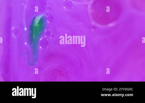 Oil paint. Fantasy ink. Defocused pink green blue color spill shiny ...