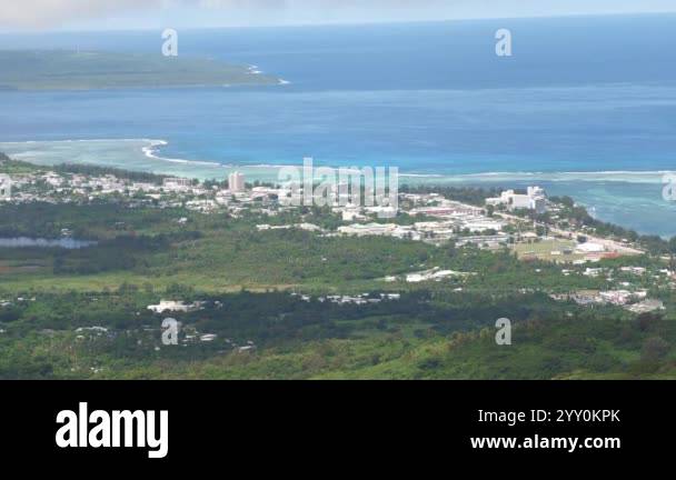 Medium wide footage of Susupe Village and the Saipan lagoon, with ...
