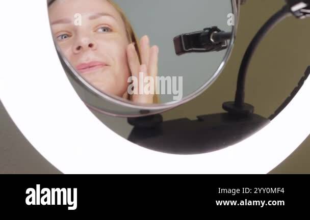 young woman looking through her eyes in the mirror. high quality photo ...