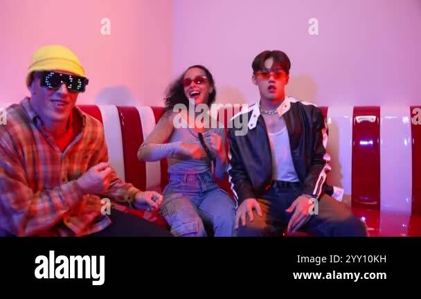 Happy dancing team wearing fancy glasses while moving to city pop or ...