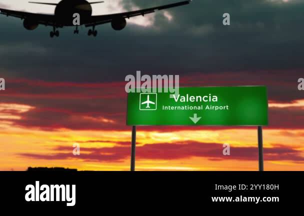 Airplane silhouette landing in Valencia, Spain. Plane city arrival with ...