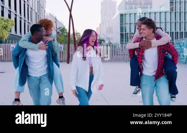 young friends enjoy time together outdoors. Two friends carry others on ...