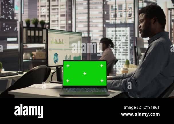 Male general manager looking at mockup screen and solving tasks for ...