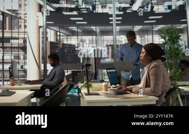 Team of business associates discuss about a project focused on ...