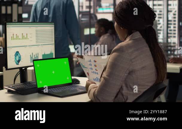 Corporate employee focused on strategic planning next to green screen ...