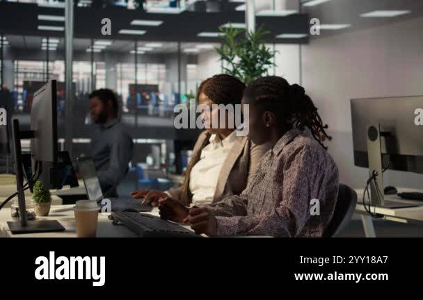 Black business staff strategizing a plan for growth in modern office ...