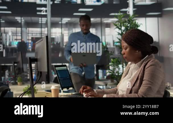 African american team members engaged in administrative tasks with ...