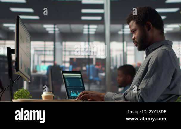 Analyst studying infographics and performance metrics for decision ...