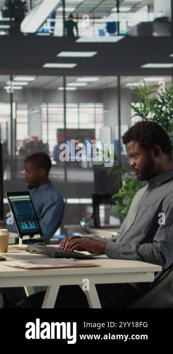 Vertical Video Analyst studying infographics and performance metrics ...