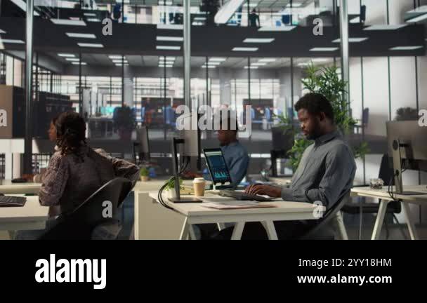 Analyst studying infographics and performance metrics for decision ...