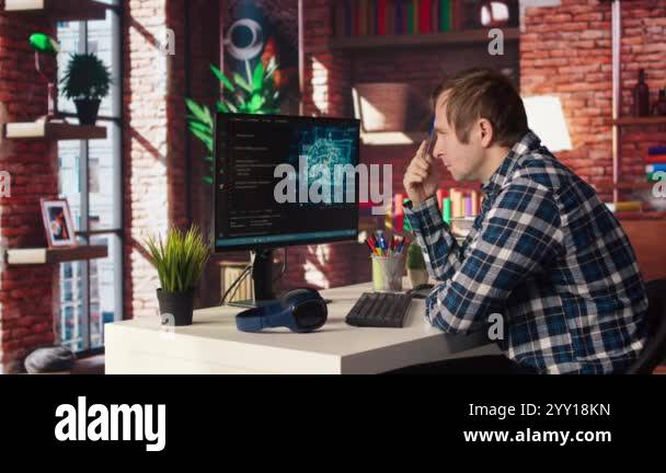 AI software developer at computer waiting for code to finish compiling ...