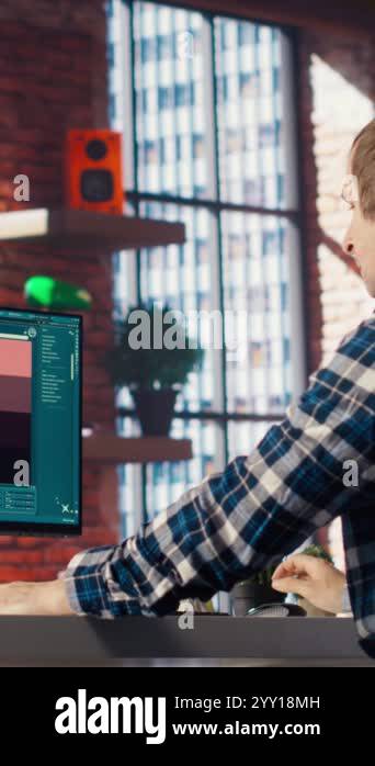 Man In Apartment Workspace Using Ai Software Turning Text Prompt Into