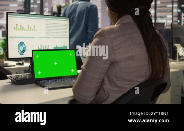 Corporate employee focused on strategic planning next to green screen ...