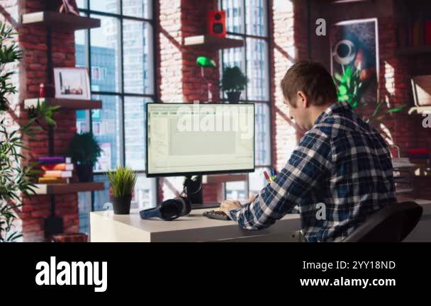 Man In Home Office Looking At Ui On Pc Screen Typing And Executing Programming Code Coding