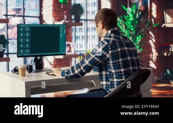 Man seated at desk using AI LLM chatbot software in modern urban home office. Person requesting ...