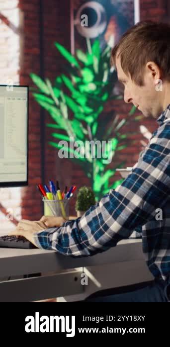 Man In Home Office Looking At Ui On Pc Screen Typing And Executing Programming Code Coding
