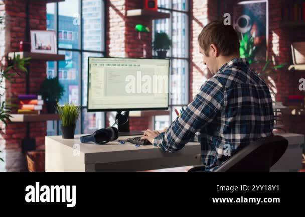 Software developer at computer coding, stretching joints after sitting ...