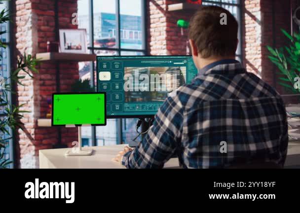 Man In Home Office Uses Ai Program Turning Text Prompt Into Videos Next To Isolated Screen