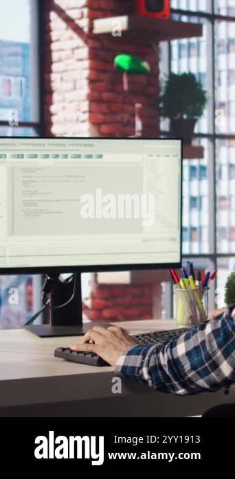 Programmer At Desk Typing Code Into Computer Developing Software Programs Consulting Green