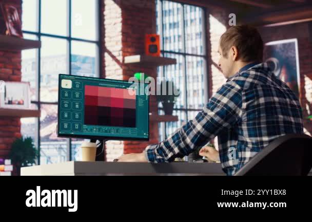 Man in apartment workspace using AI software turning text prompt into photos. Person in brick ...