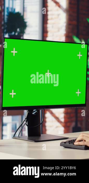 Teleworker in living room home office using chroma key PC to answer ...