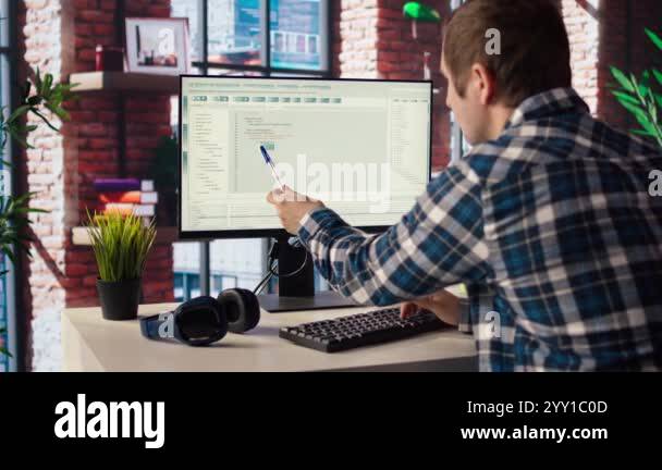 Programmer At Desk Types Code Into Computer Developing Software Programs Entering Commands